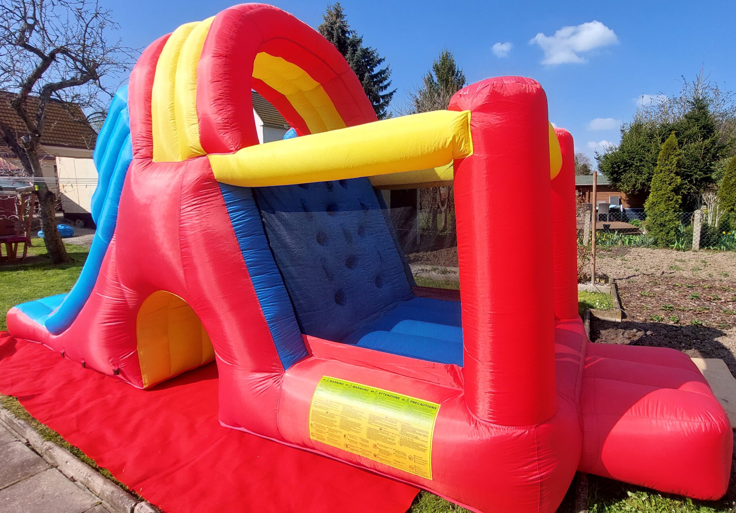 Hüpfburg mit großer Doppelrutsche und Tunnel | www.kinderfeste.cc
